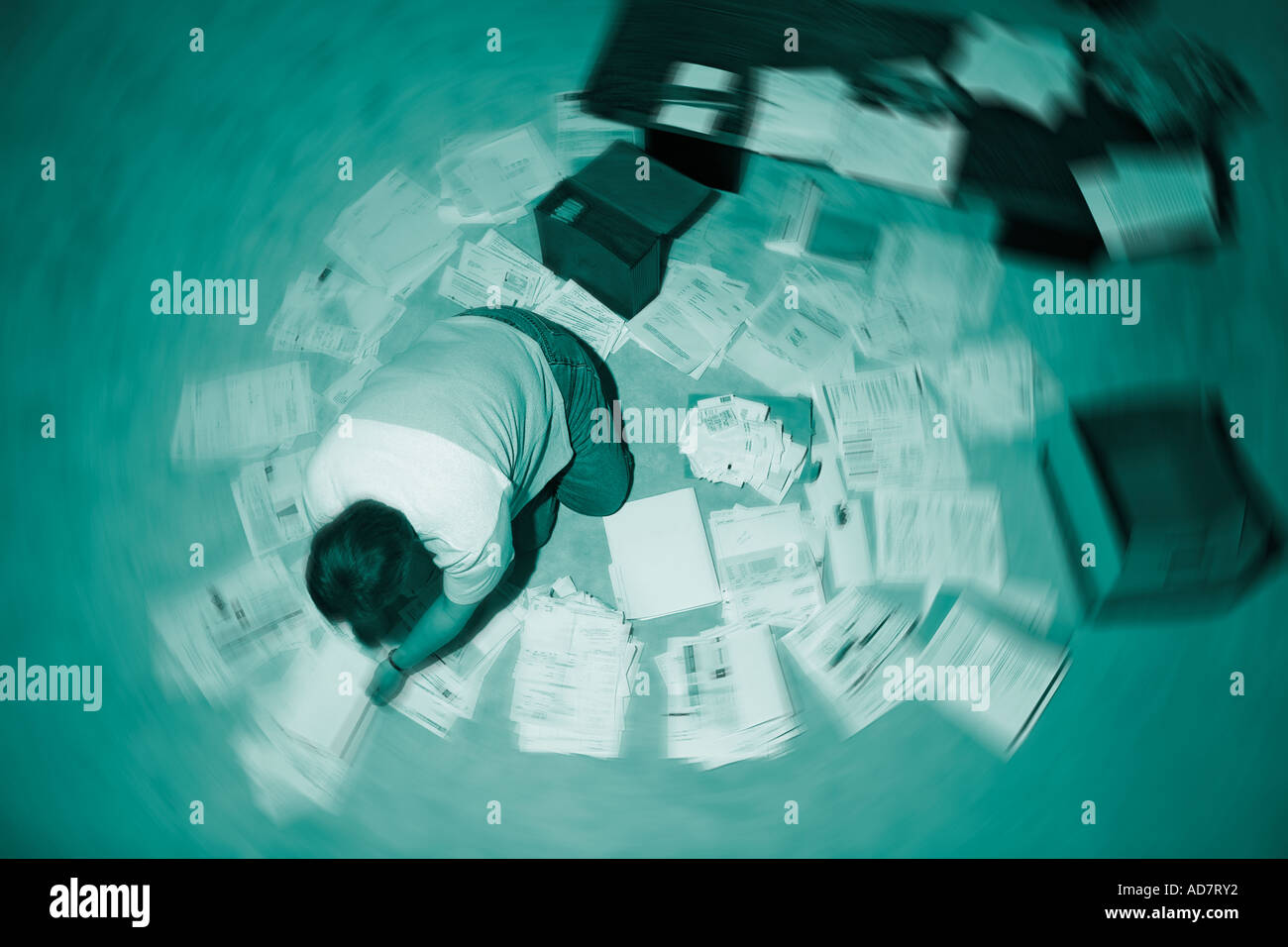 Woman on floor sorting receipts at tax time Stock Photo - Alamy