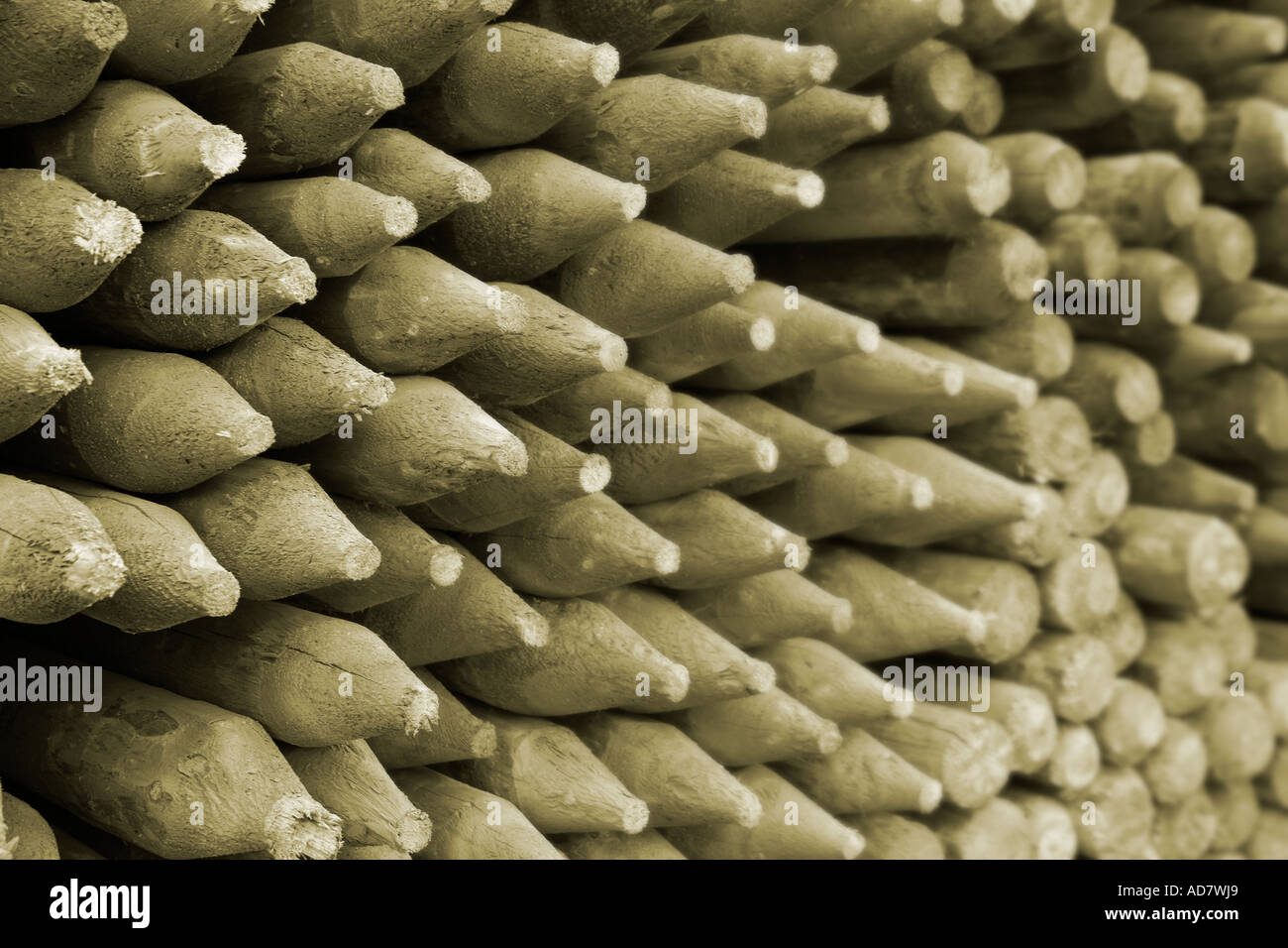 A stack of treated wood fence posts at lumber yard Stock Photo - Alamy