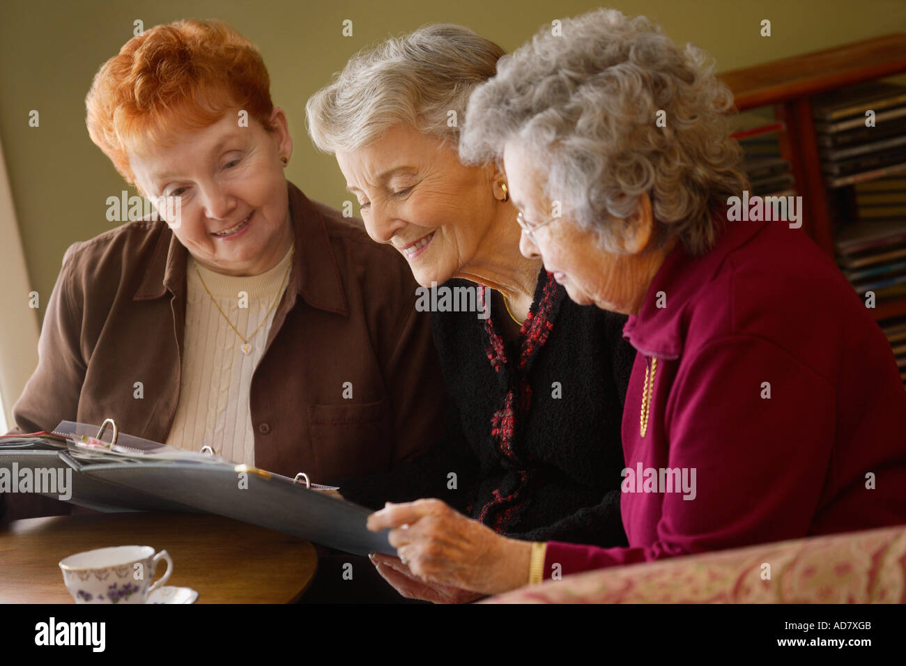 Three ladies enjoying photos Stock Photo - Alamy