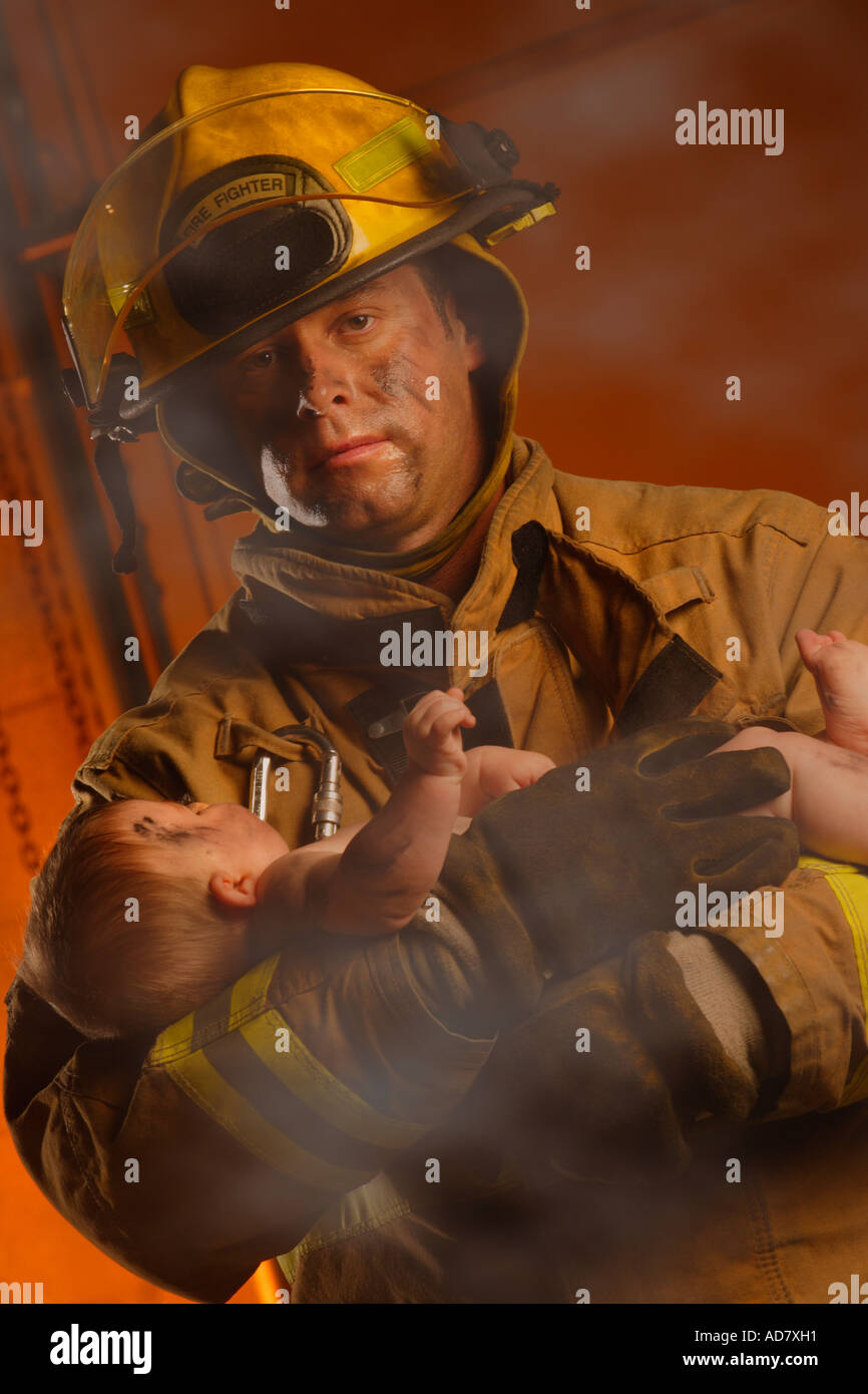 Fireman rescuing a baby Stock Photo - Alamy