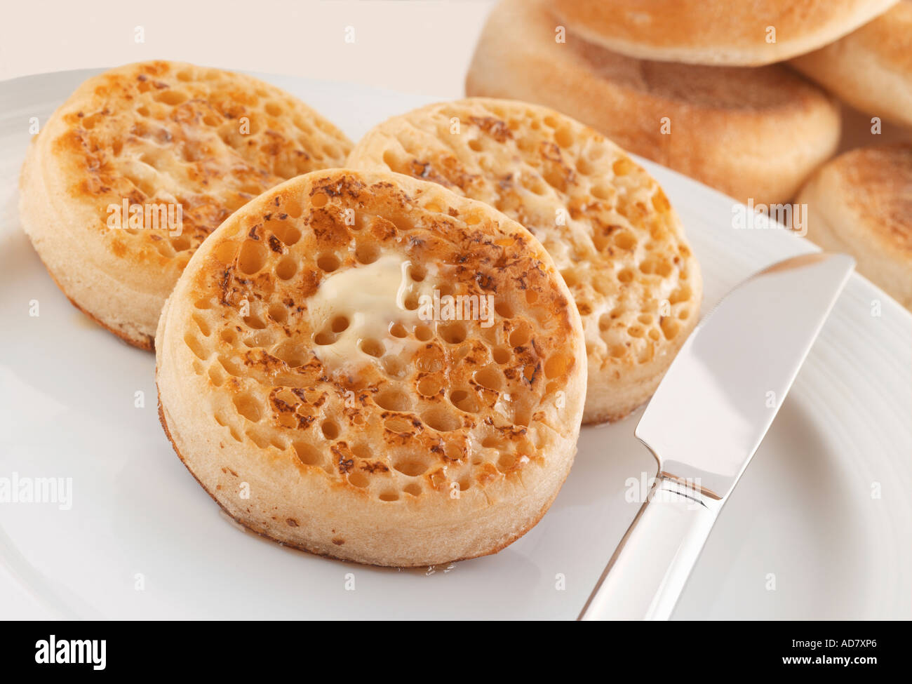 Hot buttered crumpets Stock Photo - Alamy