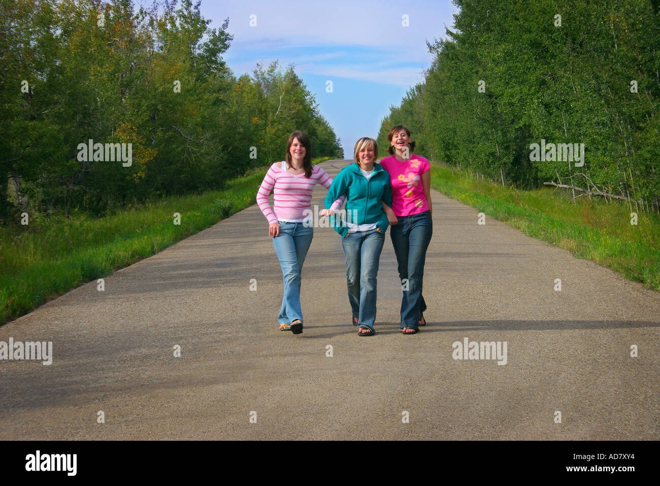 Girls walking together Stock Photo - Alamy