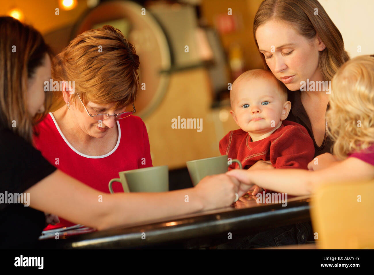 Family praying together Stock Photo - Alamy