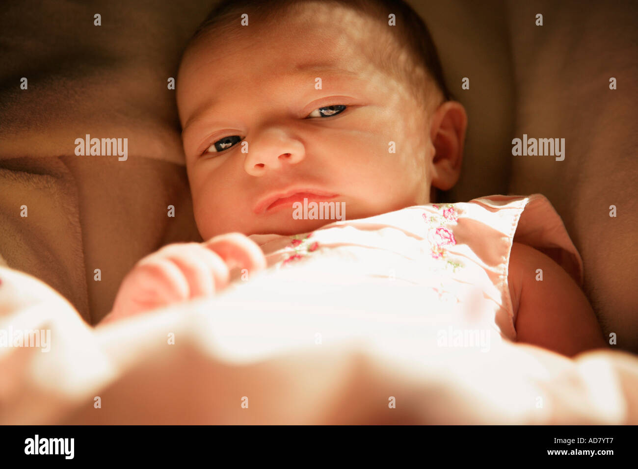 Baby lying down Stock Photo - Alamy