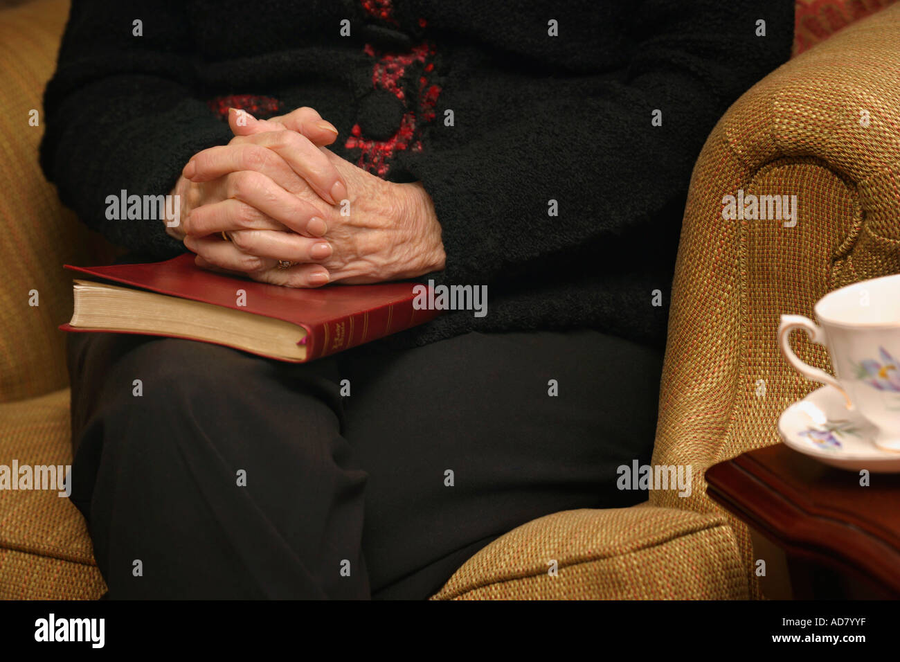 Senior woman in prayer Stock Photo - Alamy