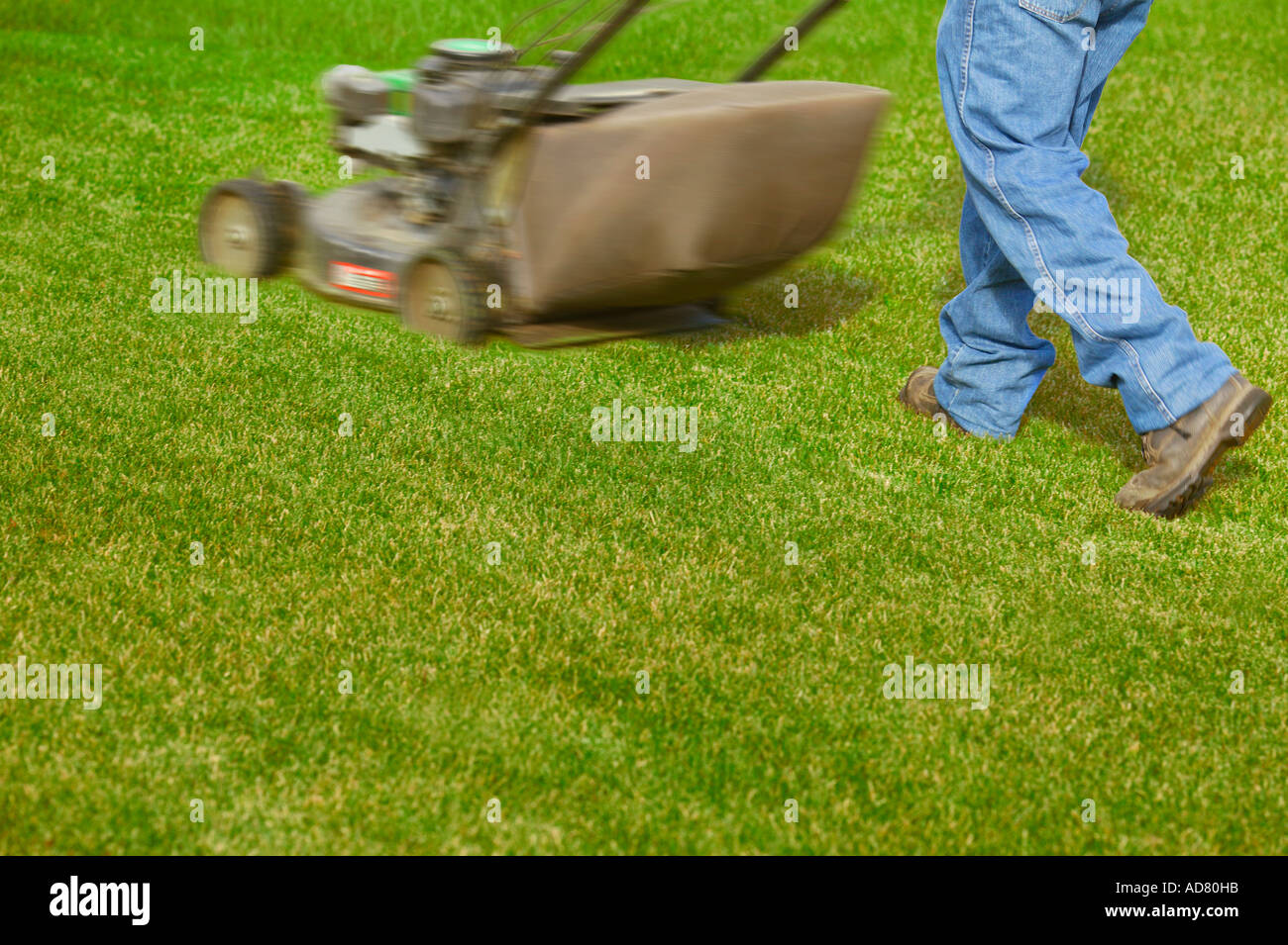 Mowing the lawn Stock Photo - Alamy
