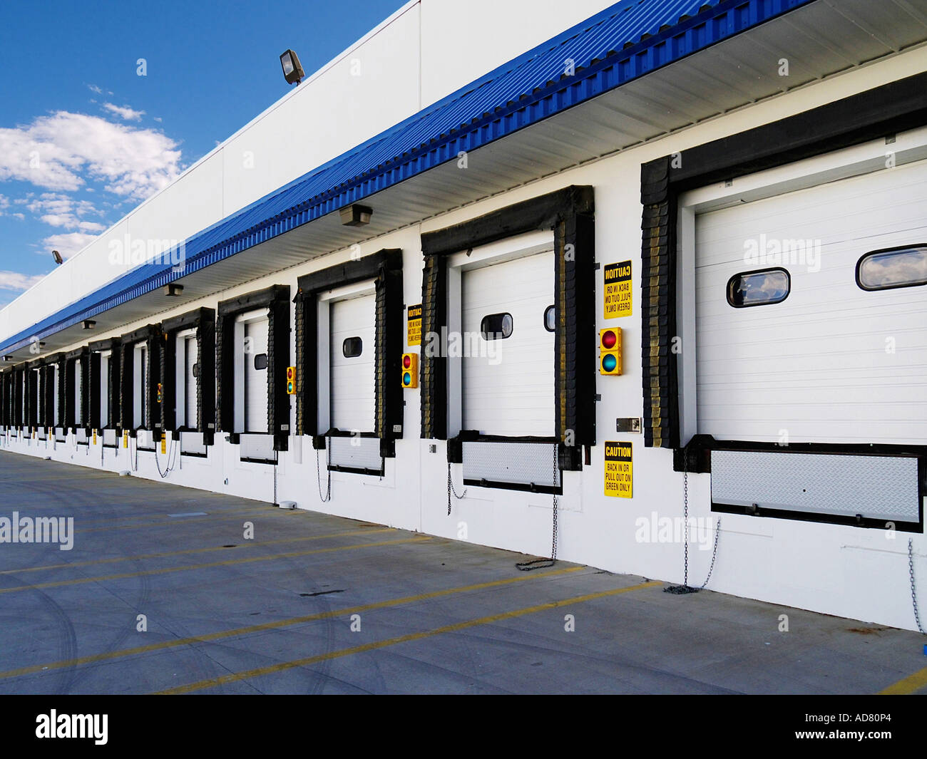 Endless line of loading dock doors stretching into the distance beneath ...