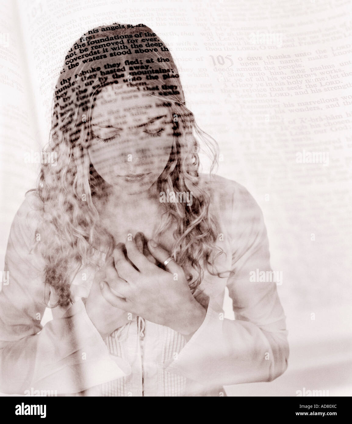 Praying with Bible overlay Stock Photo - Alamy