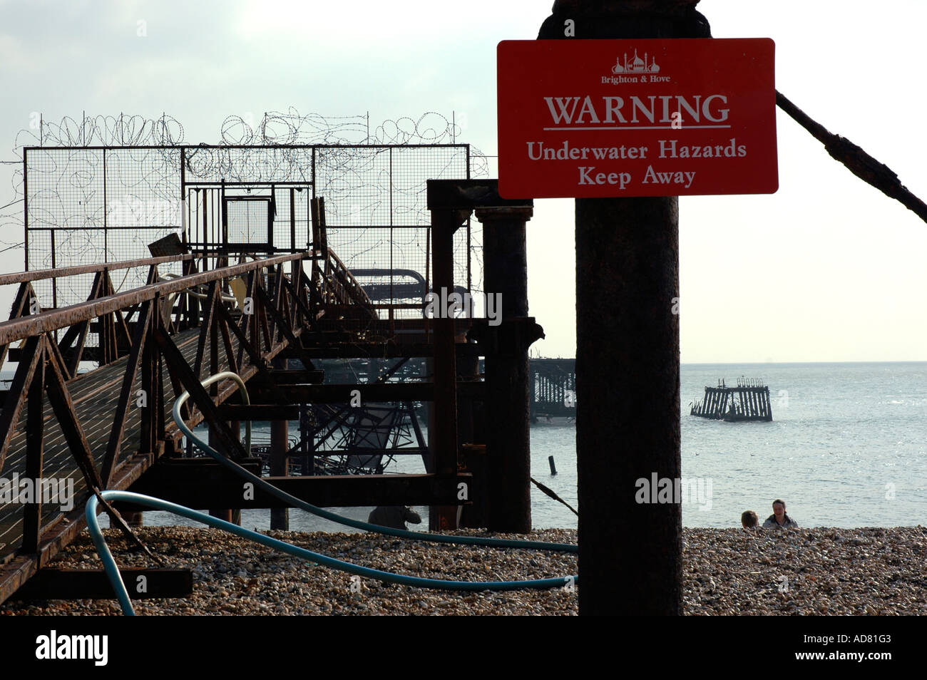 Warning sign on fire damaged West Pier, Brighton, East Sussex, UK Stock ...