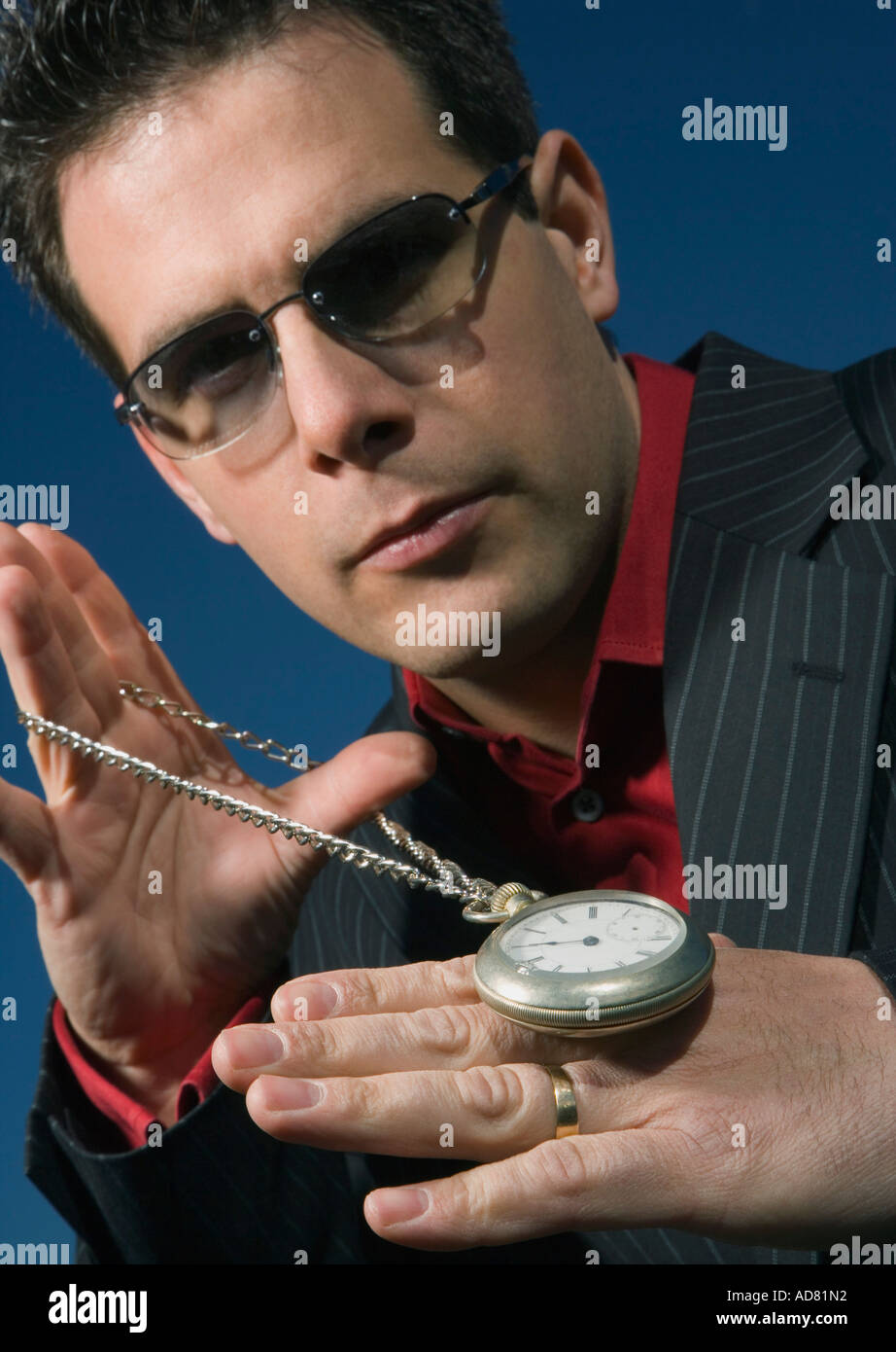 Man holding a pocket watch Stock Photo - Alamy