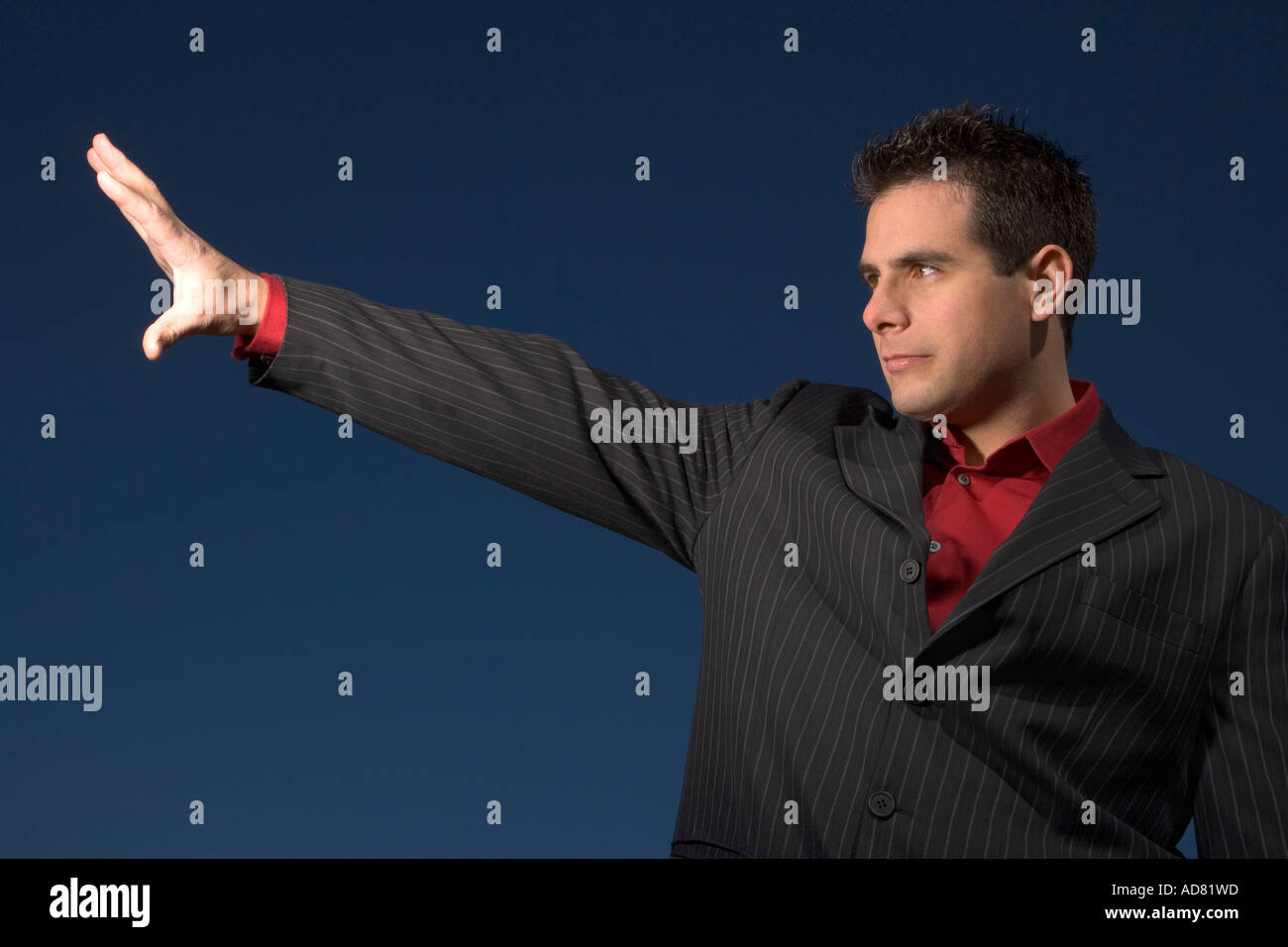 Man with arm outstretched Stock Photo - Alamy