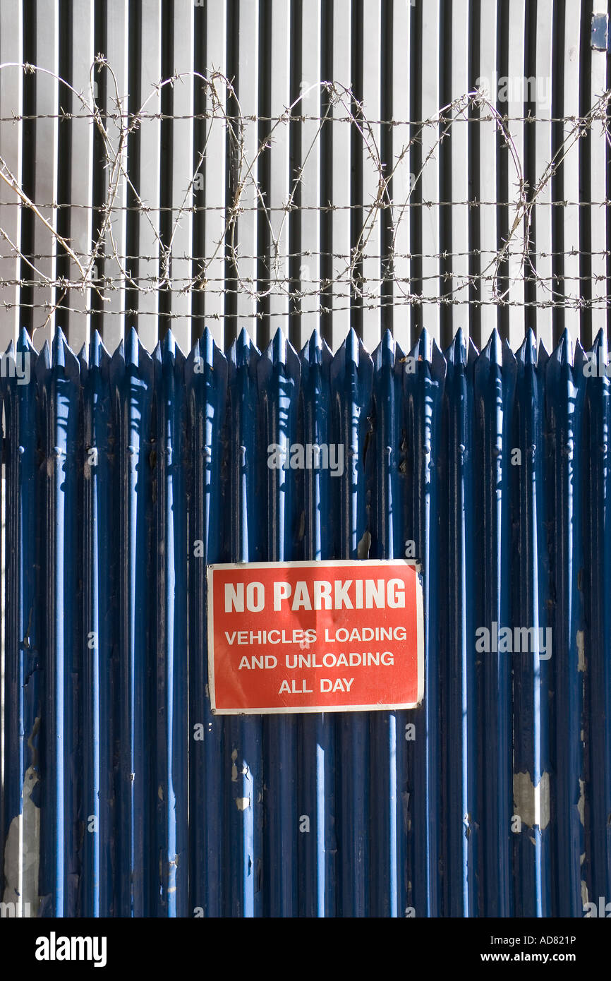 A sign reading NO PARKING vehicles loading and unloading all day on a ...