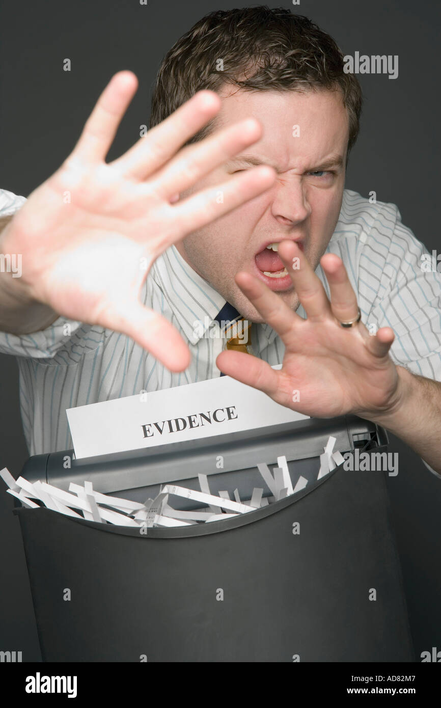 Man shredding evidence Stock Photo - Alamy