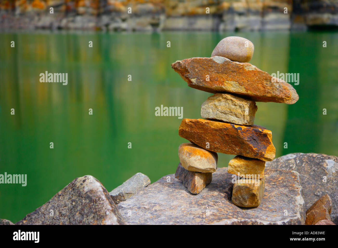 Rock art figure at waters edge Stock Photo - Alamy
