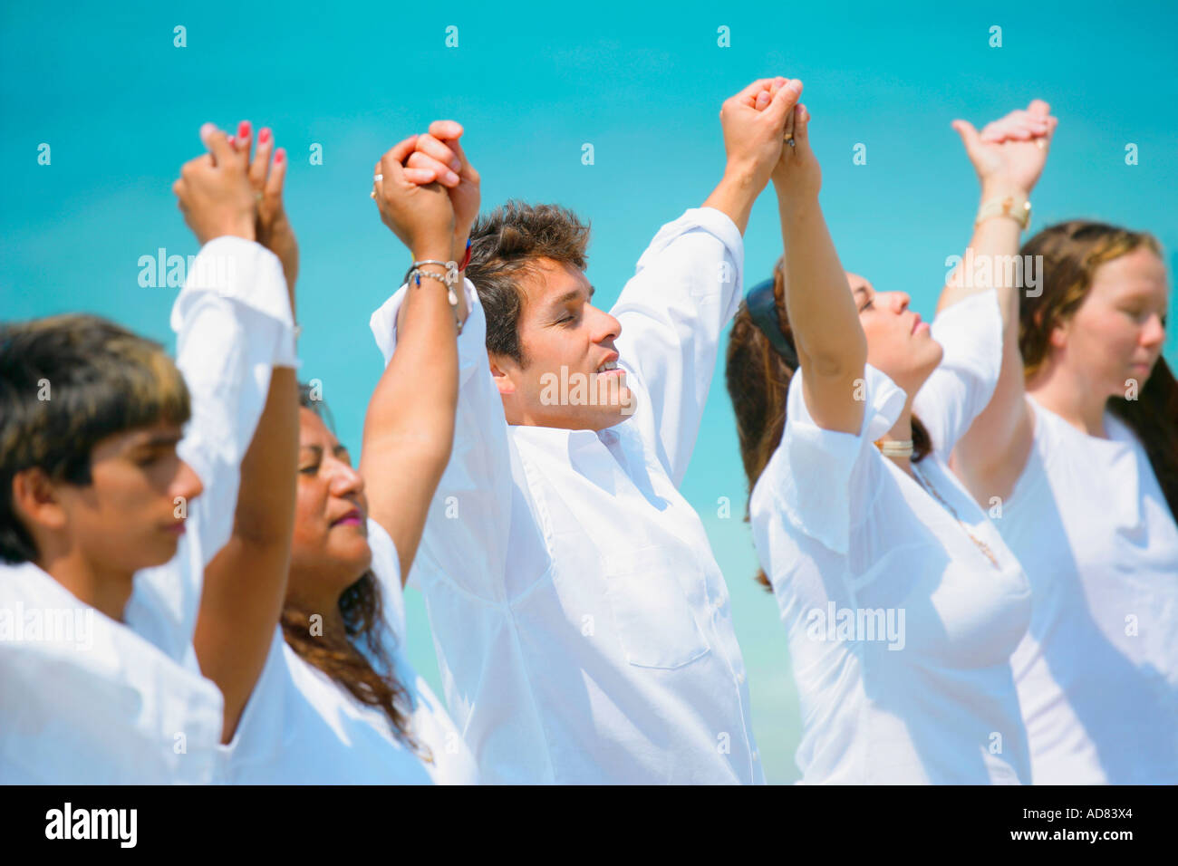 Group of people in worship Stock Photo - Alamy