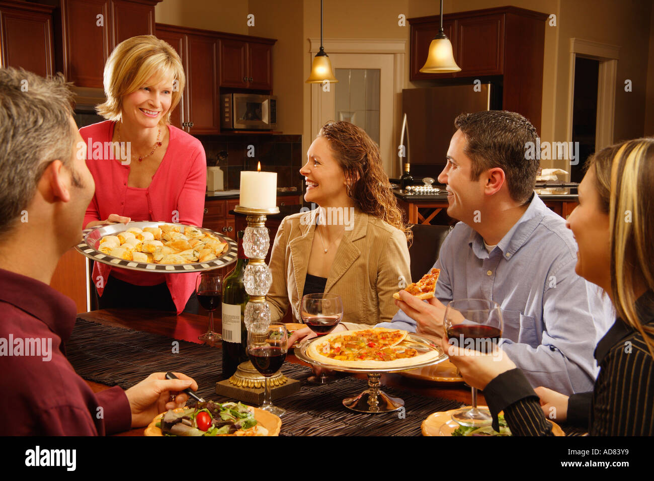 Entertaining guests dinner party hi-res stock photography and images ...