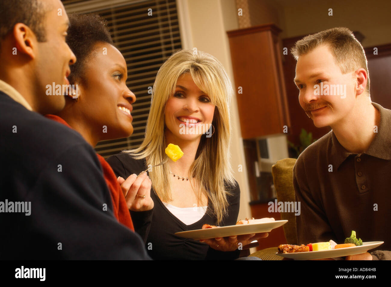 Couples sharing a meal together Stock Photo - Alamy
