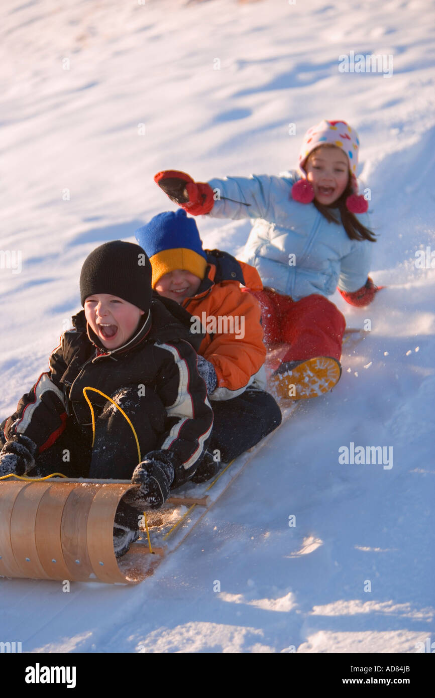 Children on a sled Stock Photo - Alamy