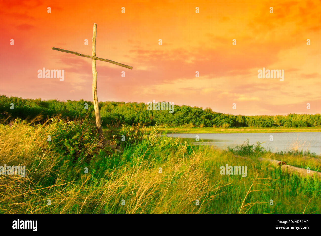 Cross with sunset Stock Photo - Alamy