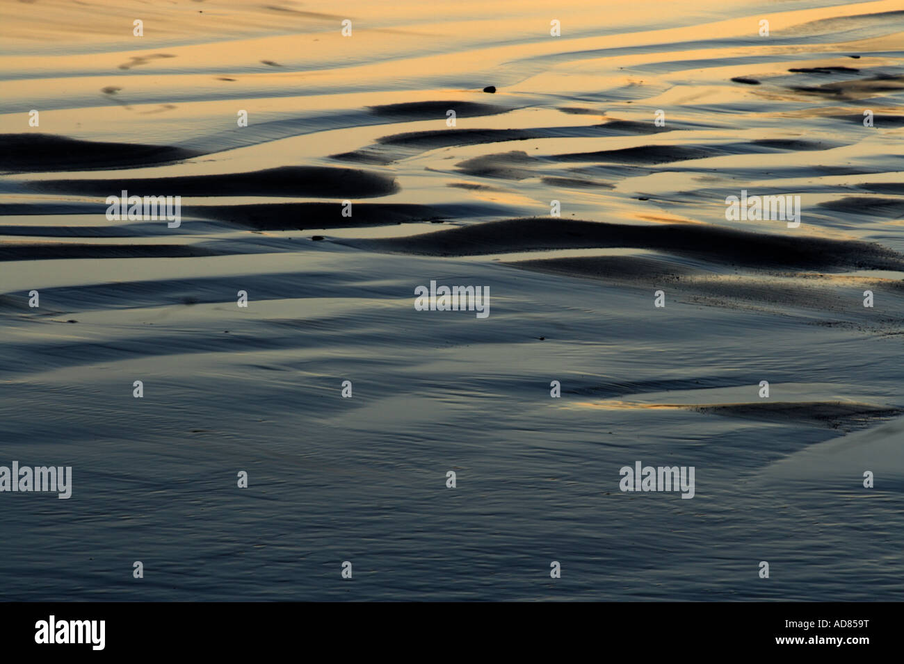 Sand and Water Reflection Stock Photo - Alamy