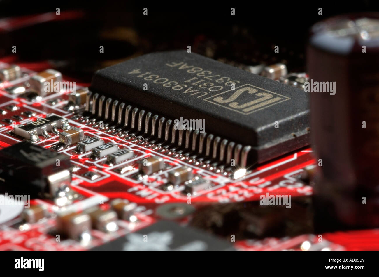 Computer chip on red motherboard Stock Photo - Alamy