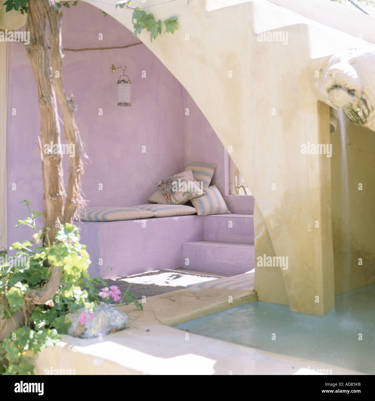Outdoor lounge with water feature Stock Photo - Alamy