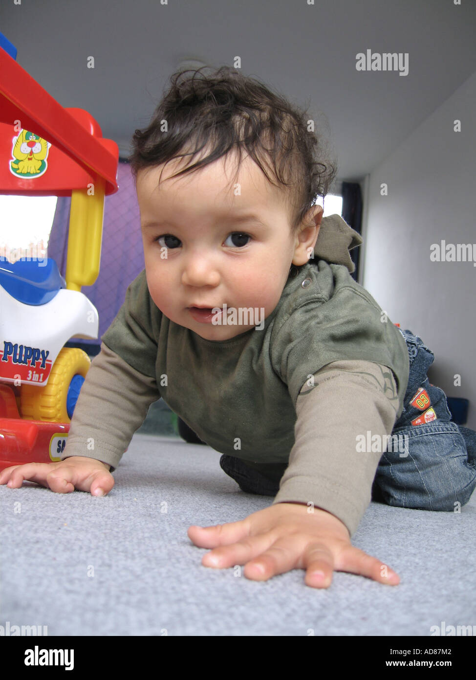 Little boy crawling towards the camera Stock Photo - Alamy