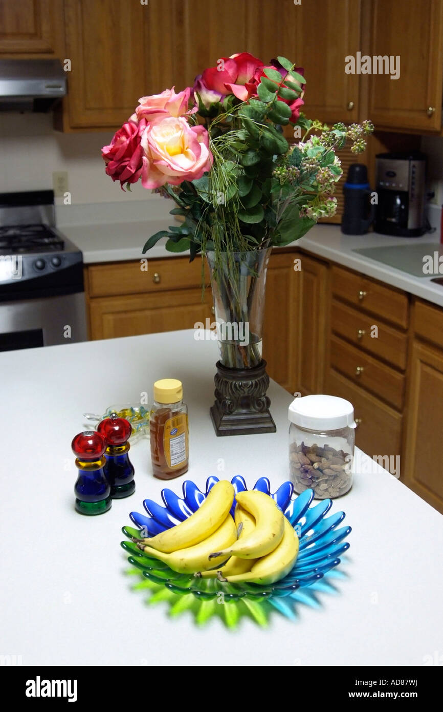 Arranged kitchen counter with flower and eatables Stock Photo - Alamy
