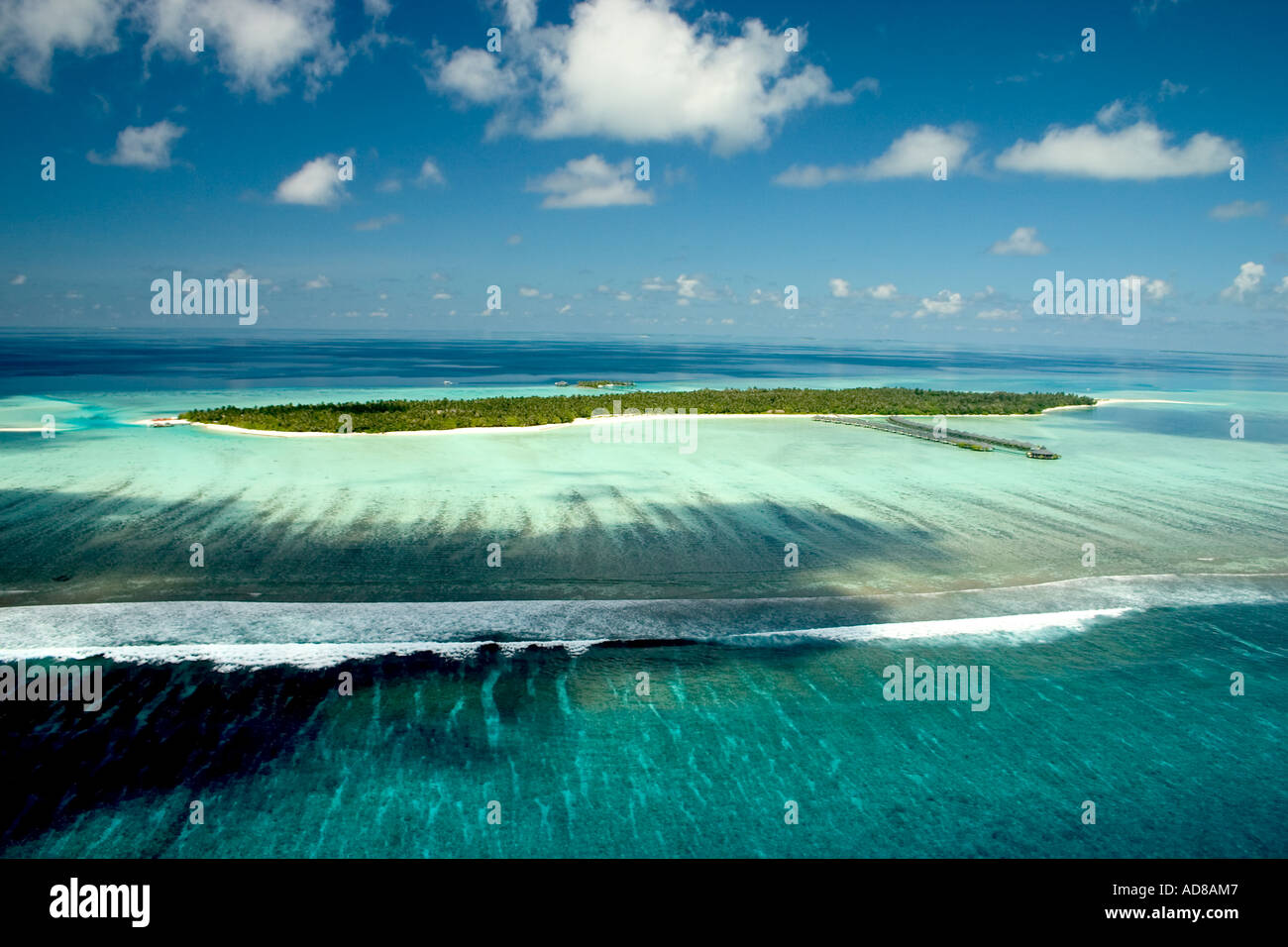 Aerial photo of an island resort, with breaking waves in view Stock ...