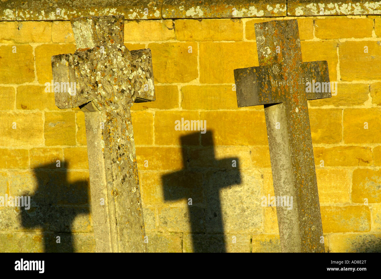 two crosses and their shadows on the graveyard Stock Photo - Alamy
