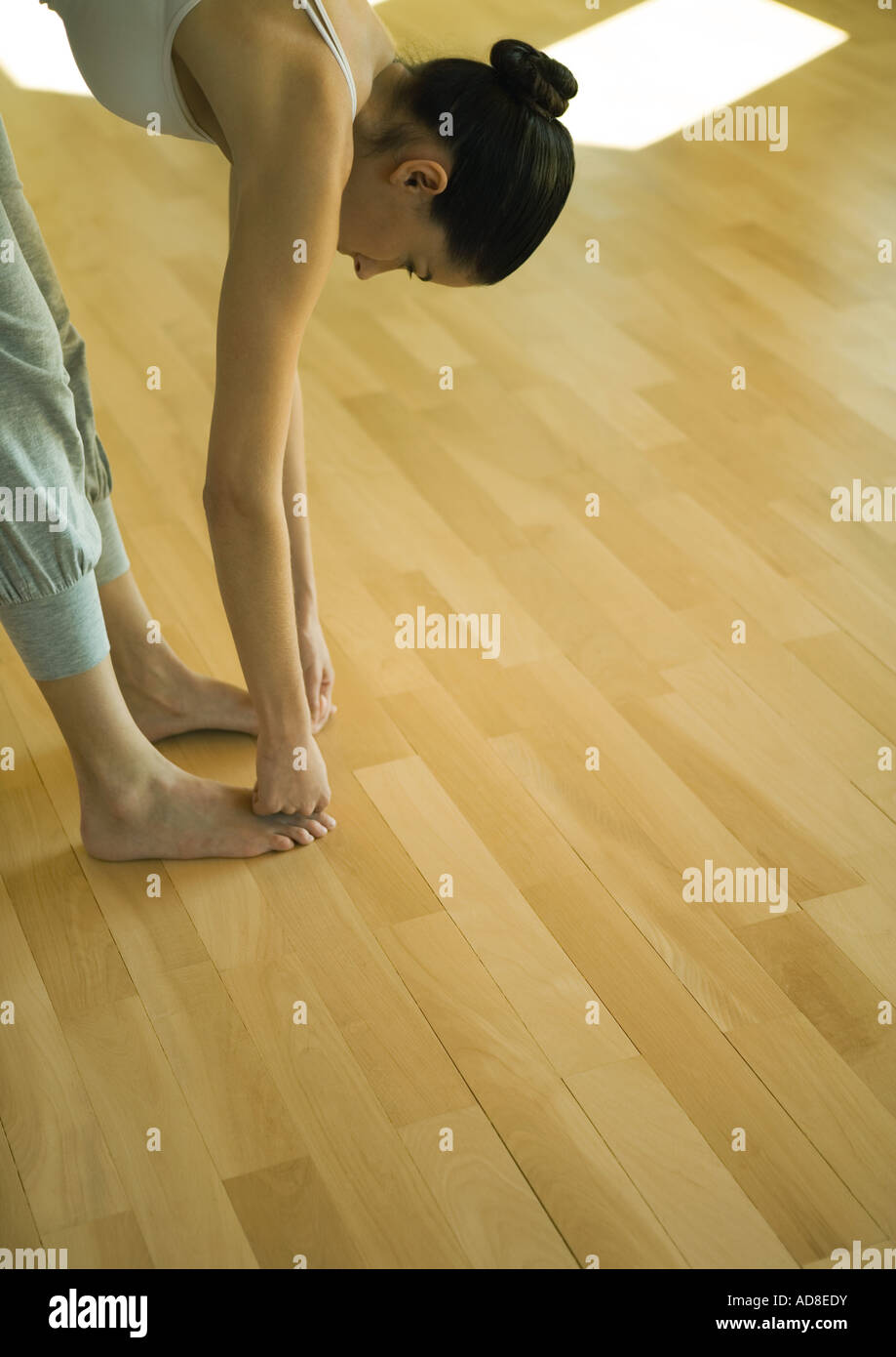 Woman bending over touching toes hi-res stock photography and images ...