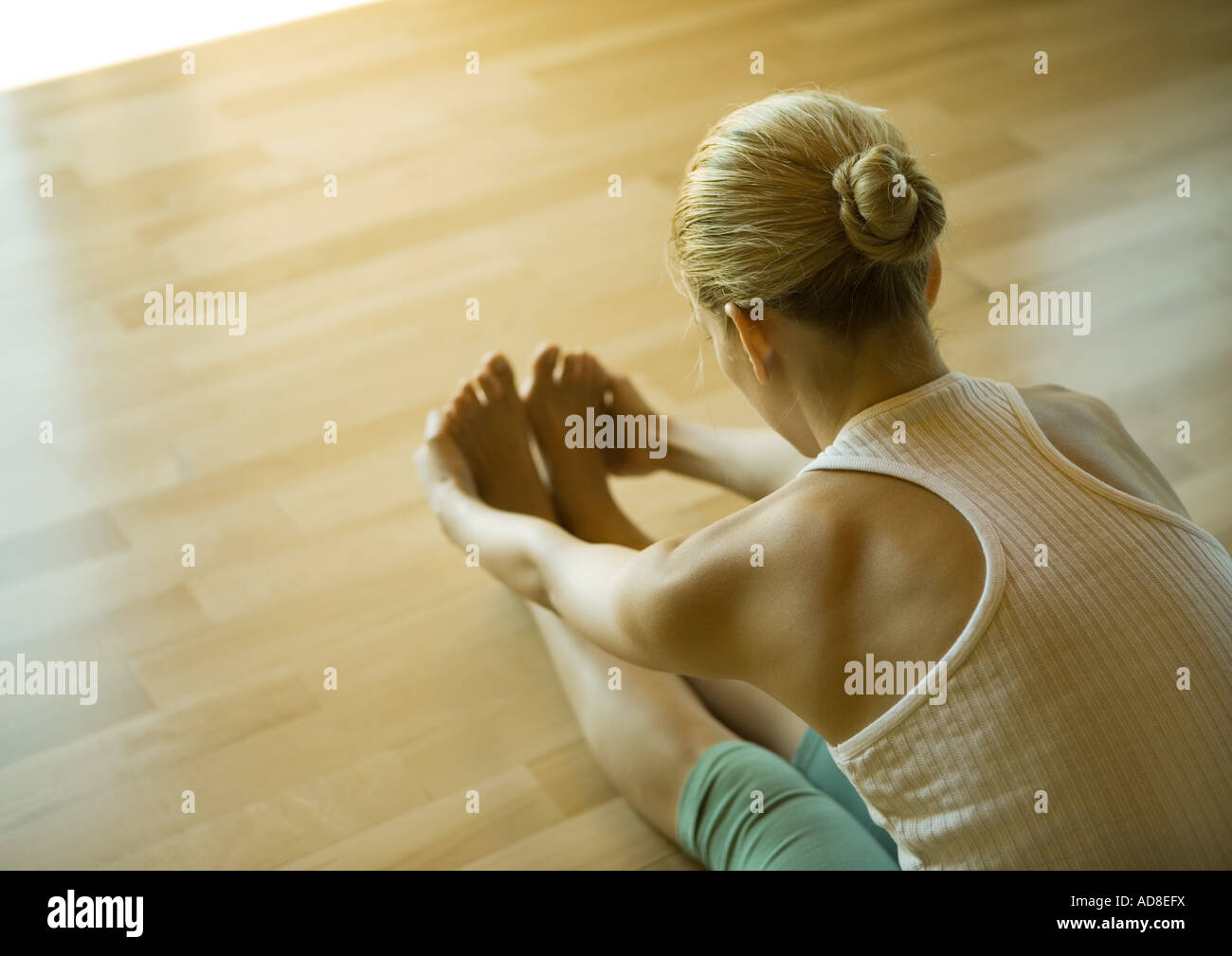 Blonde haired woman exercising, from a complete series of photos Stock ...