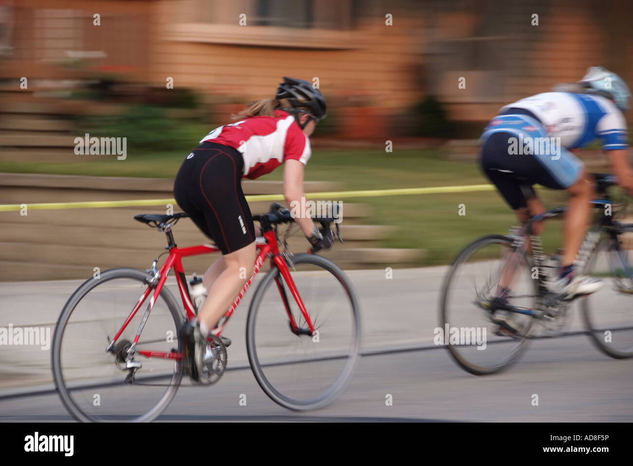 Two competing bicyclist girls Stock Photo - Alamy