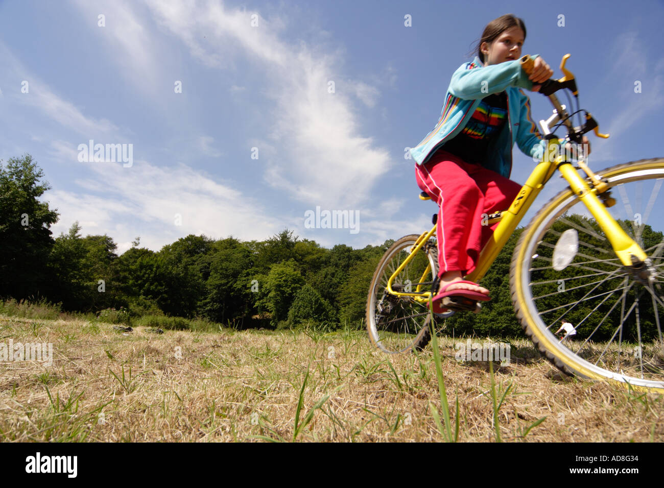 Girl riding bicycle low angle hi-res stock photography and images - Alamy