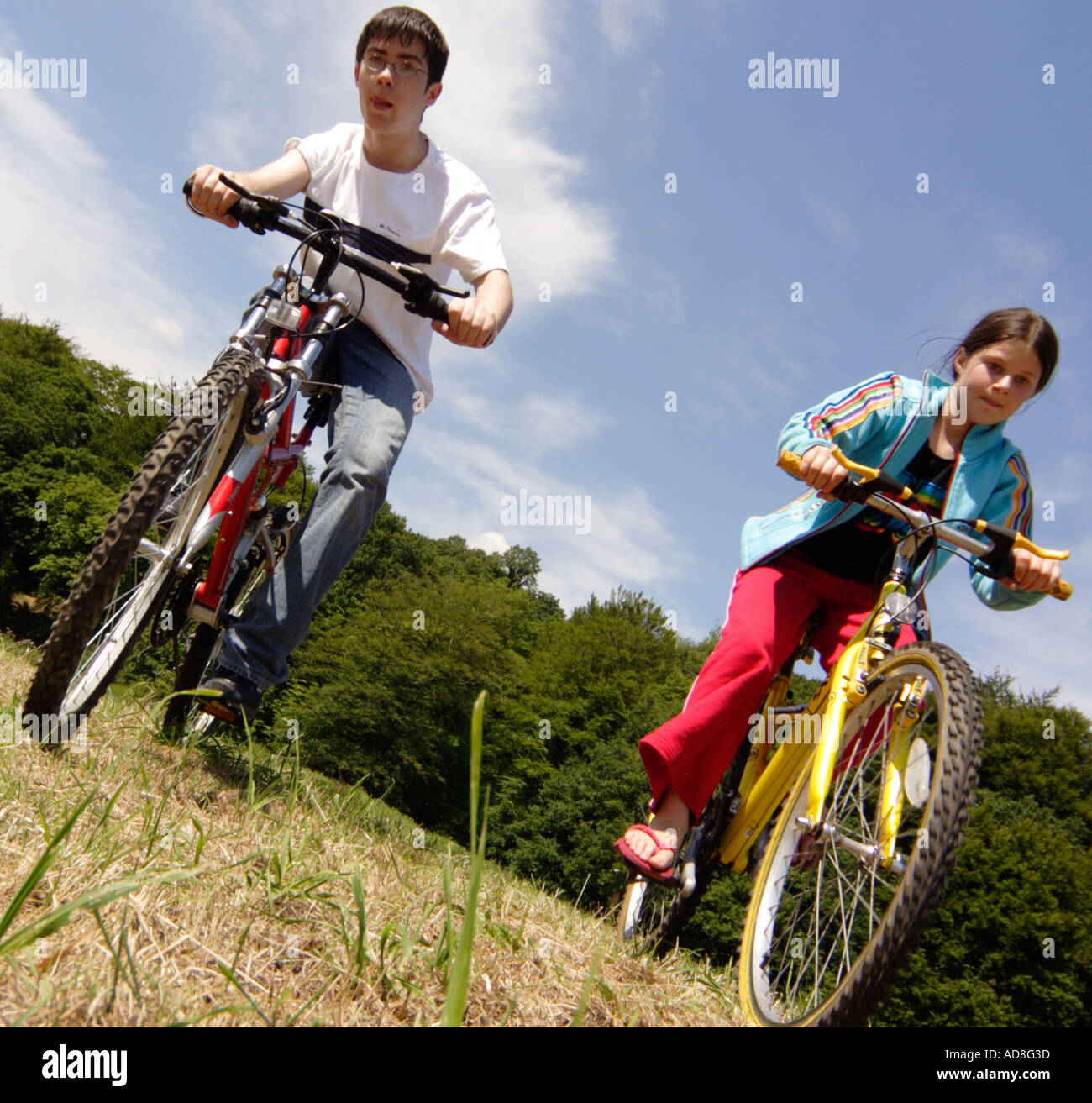 Girl riding bicycle low angle hi-res stock photography and images - Alamy