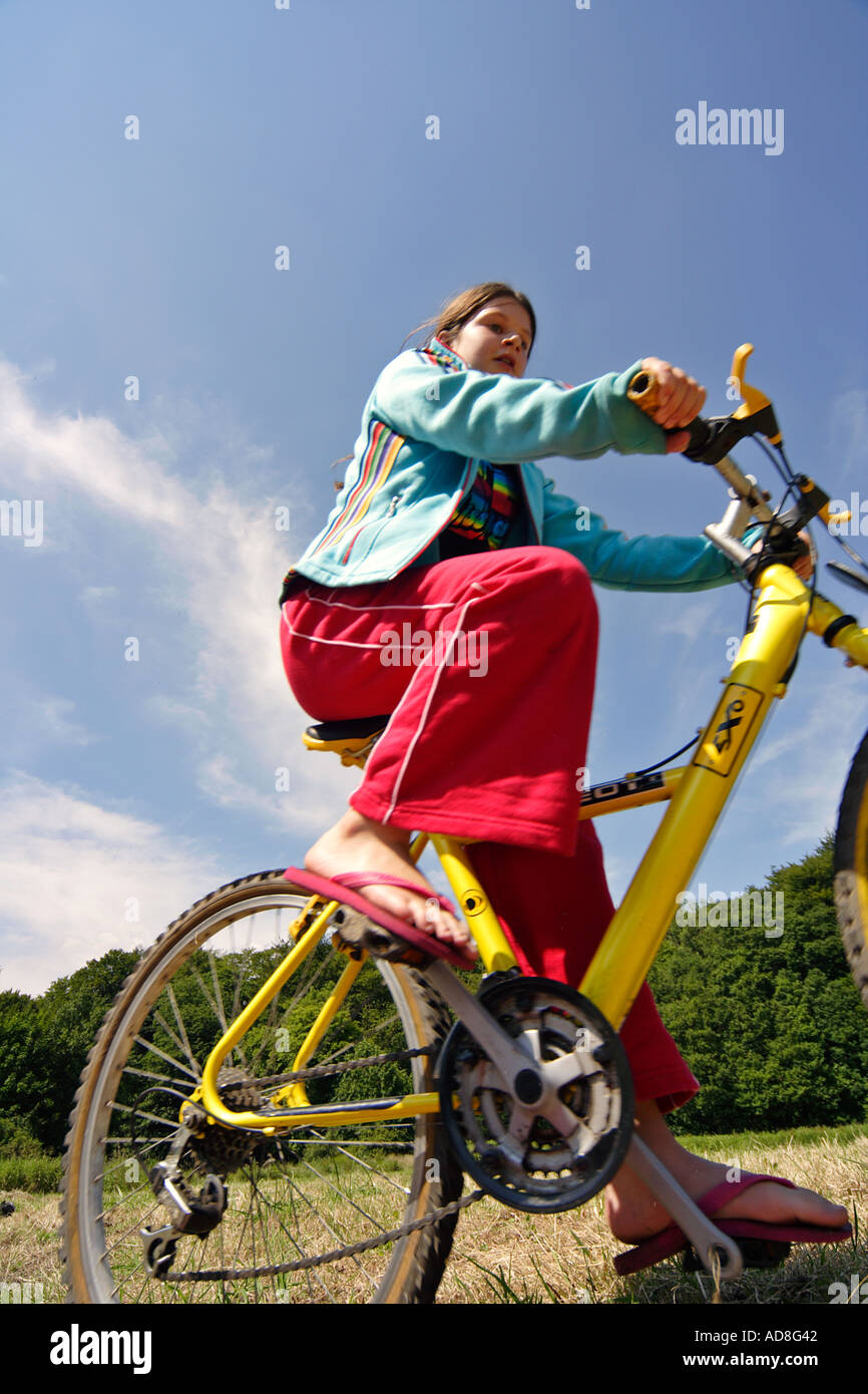 Girl riding bicycle low angle hi-res stock photography and images - Alamy