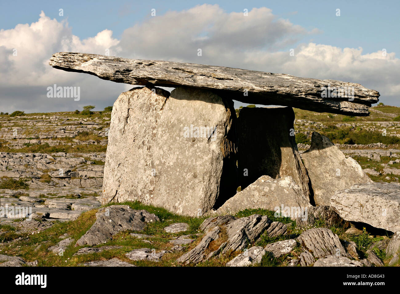 The sun imparts a warm glow to an ancient burial site Rough rocky ...