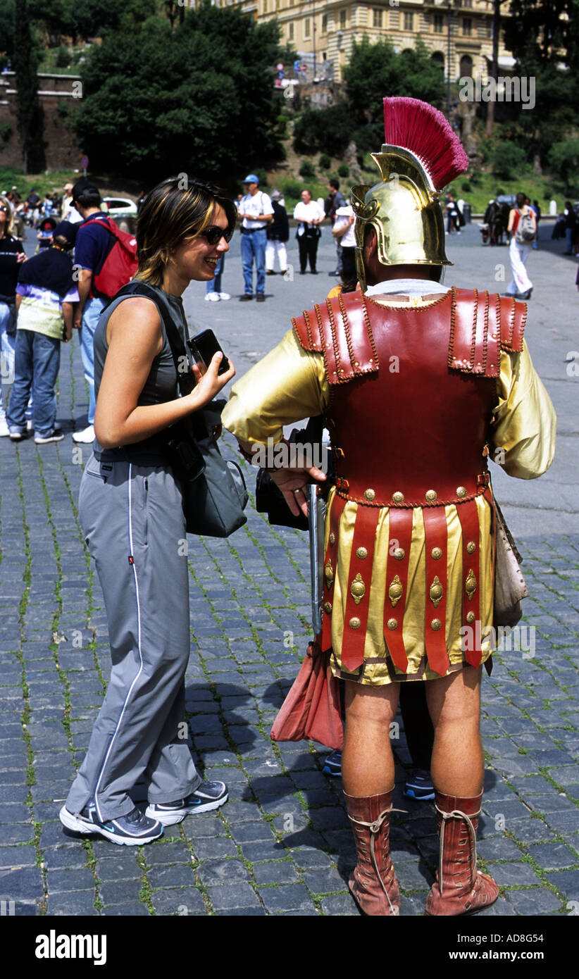 A tour guide dressed as a Roman centurion talks with a tourist, Rome ...