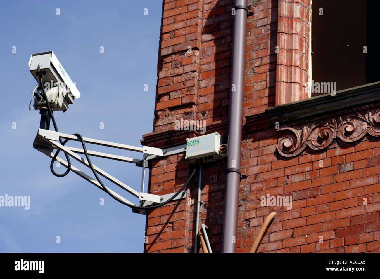 Big Brother style surveillance camera on a historic building in the UK ...