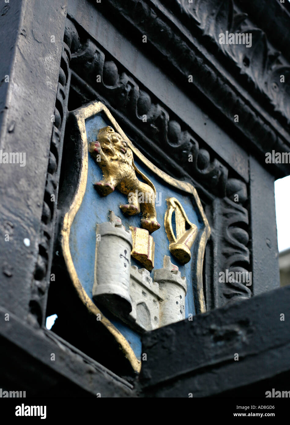 A shield that includes a lion Dublin castle and a harp in gold on a ...