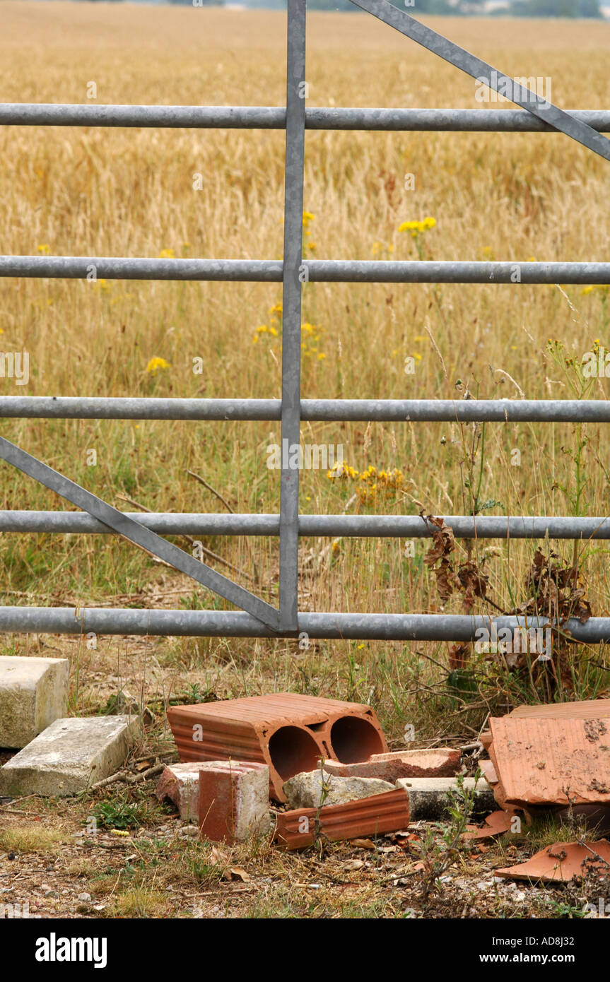 Fly Tipping in a rural field gateway Stock Photo - Alamy