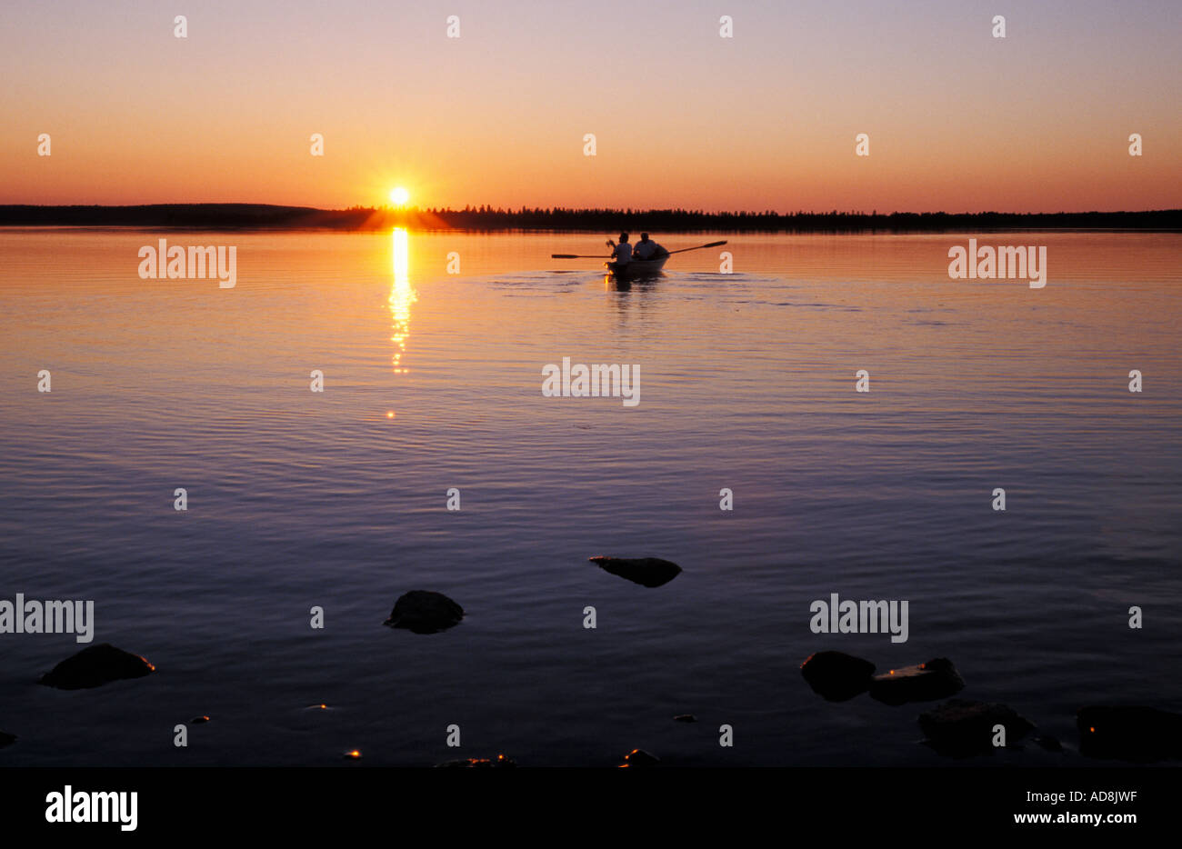 sunset at a finnish lake, fisher boat Stock Photo - Alamy