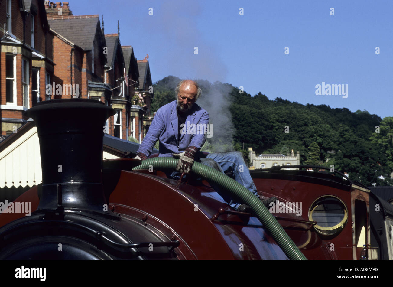Steam train filling water hi-res stock photography and images - Alamy