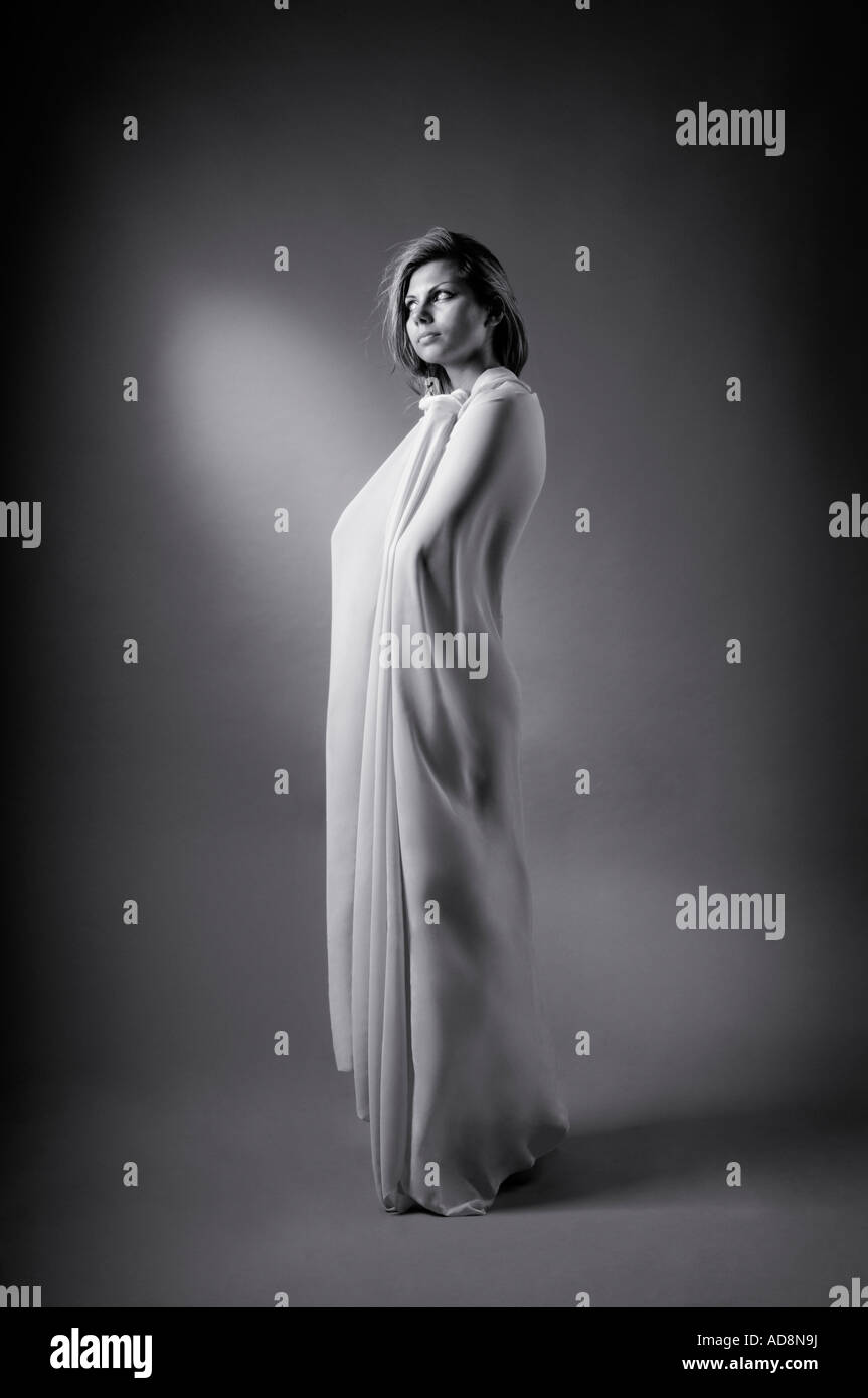 Woman wrapped in cloth isolated in studio Black white Stock Photo - Alamy