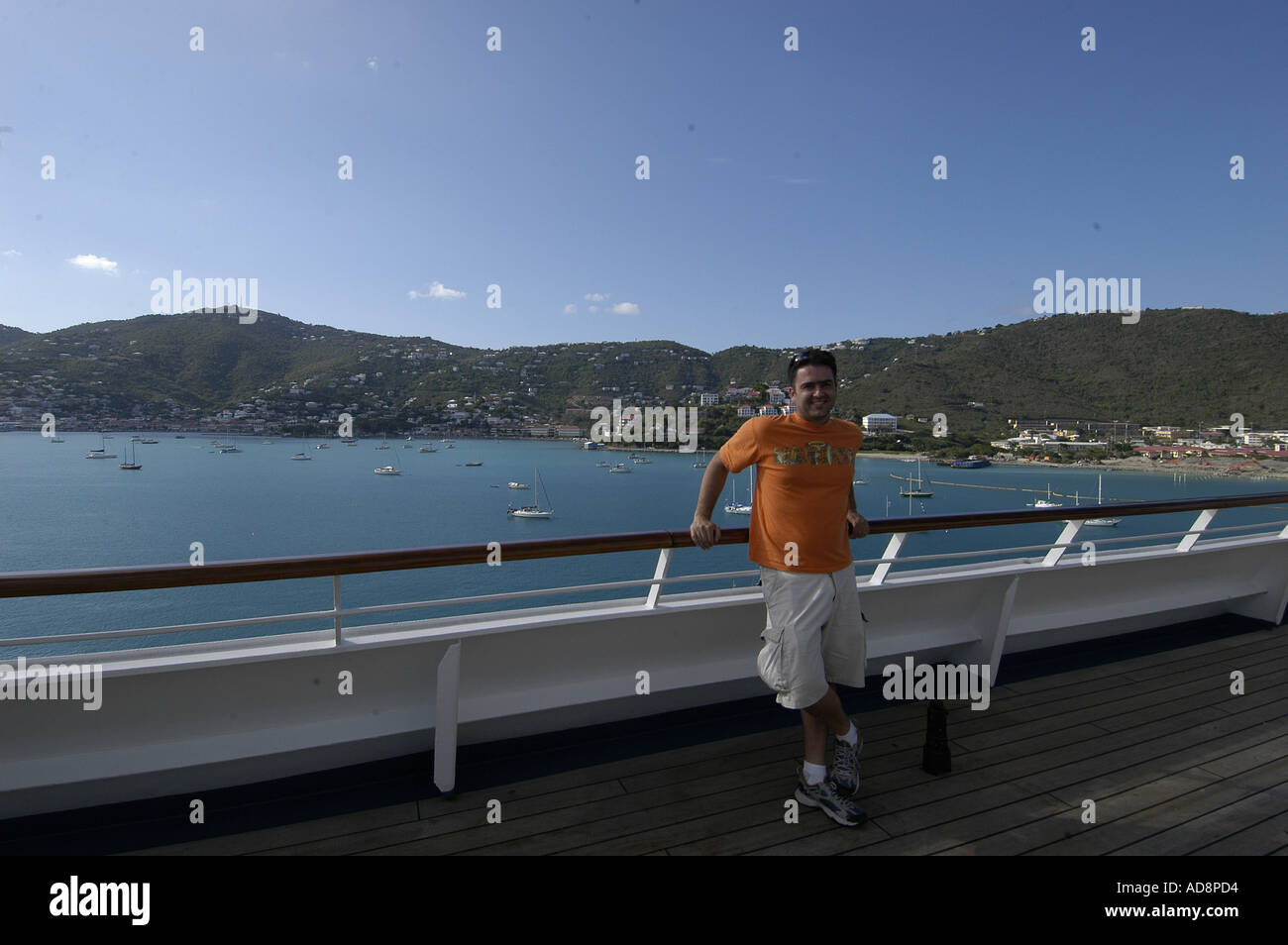 Spaniard man MR on a cruise deck Sailing boats anchored at the bay ...