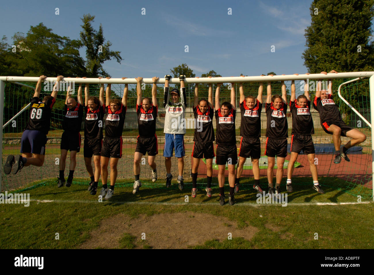 Football Team Hanging On Crossbar High Resolution Stock Photography and ...