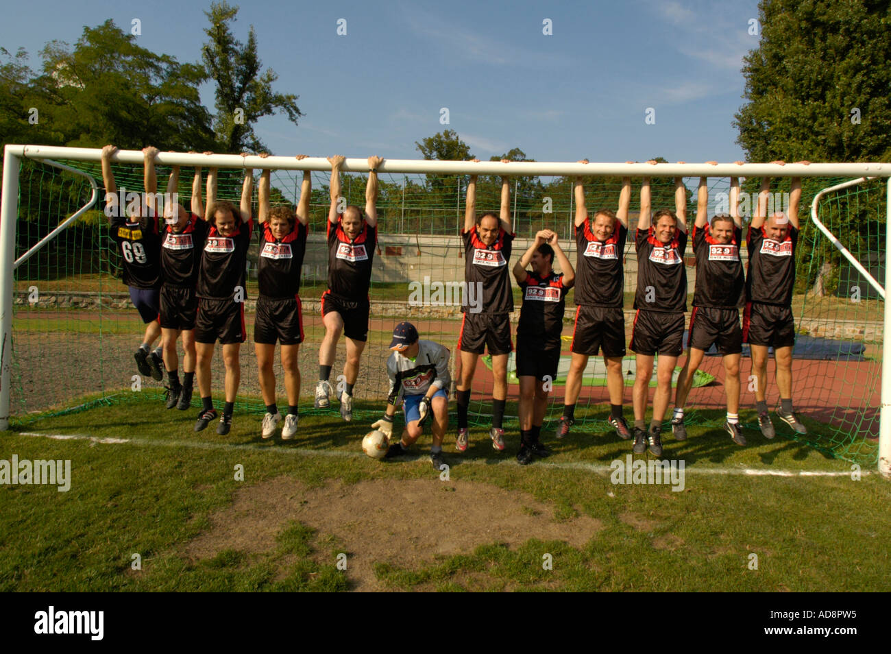 Football Team Hanging On Crossbar High Resolution Stock Photography and ...
