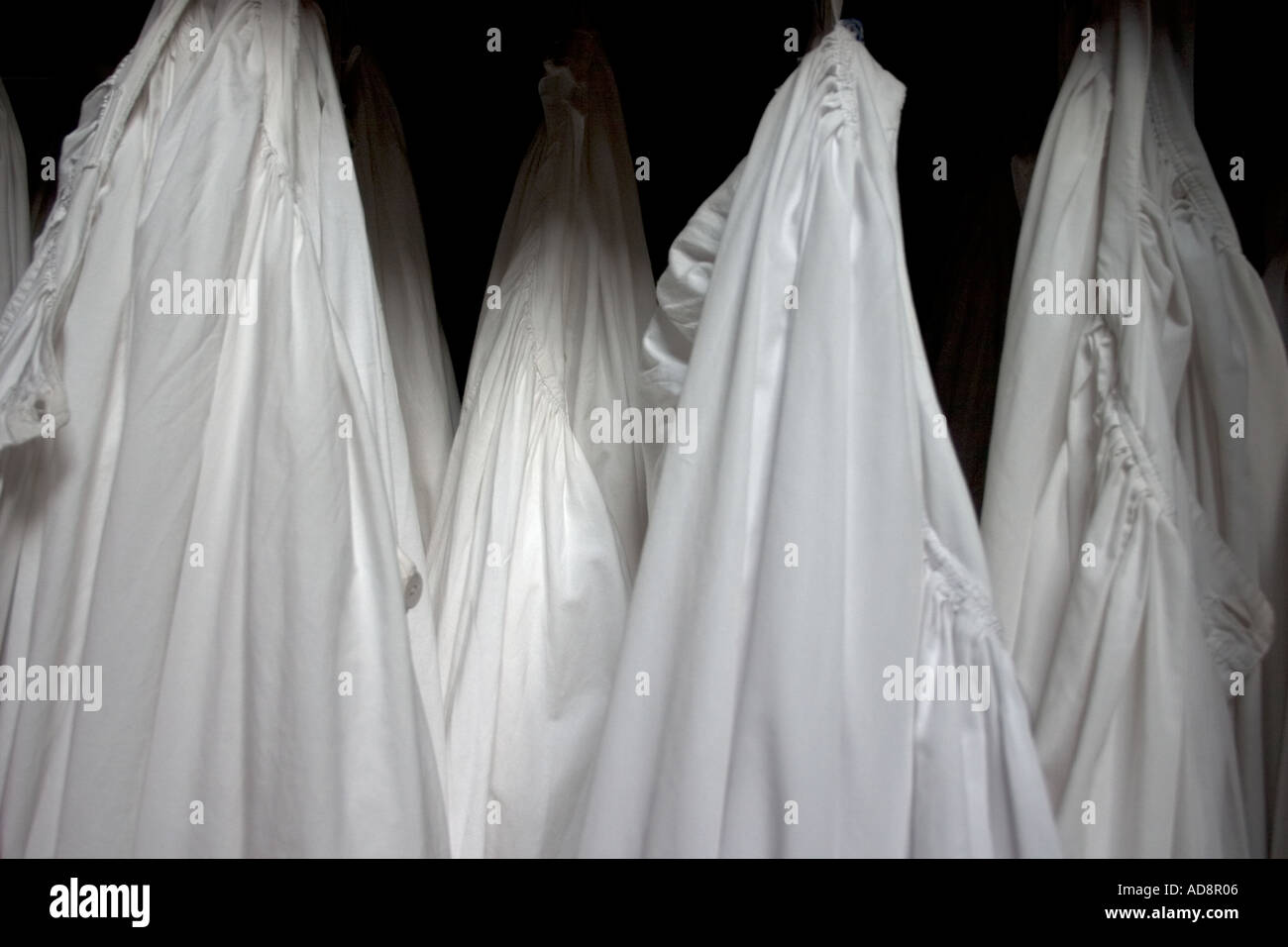 hanging white vestments Stock Photo - Alamy