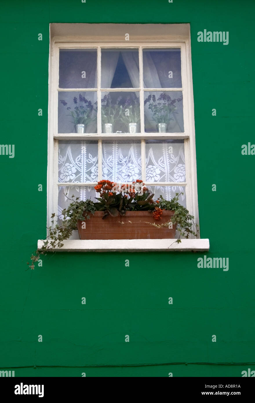 window of a house painted green Stock Photo - Alamy