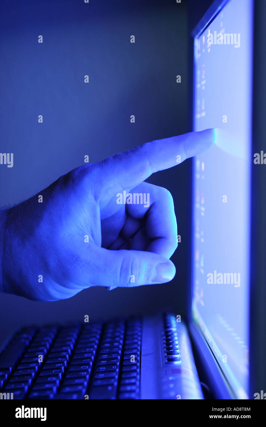 finger on the monitor Stock Photo - Alamy